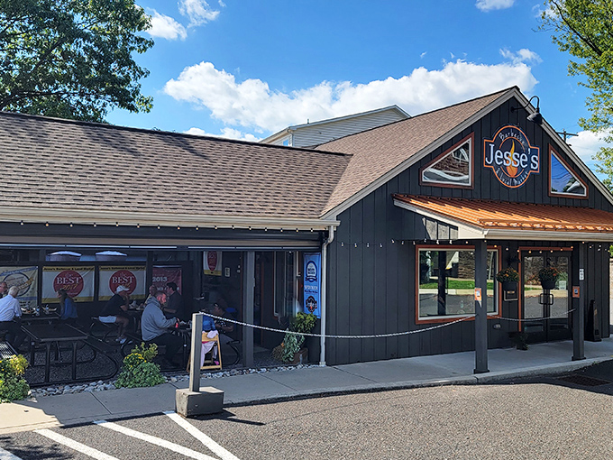 Jesse's welcoming exterior beckons hungry travelers with its rustic charm and copper accents. The promise of barbecue paradise awaits behind those doors. 