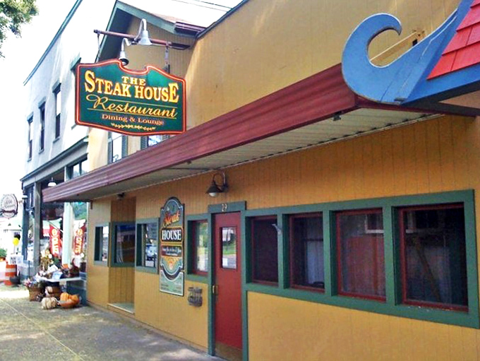 The unassuming yellow exterior hides culinary treasures within, like finding Batman's cave disguised as a suburban home in Wellsboro.