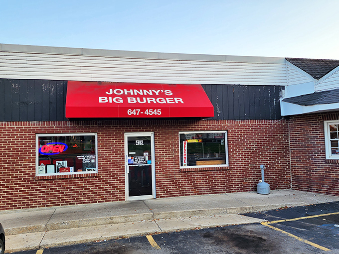 The iconic red awning of Johnny's Big Burger glows like a beacon for hungry travelers. This unassuming brick building houses burger greatness that locals have treasured for decades.
