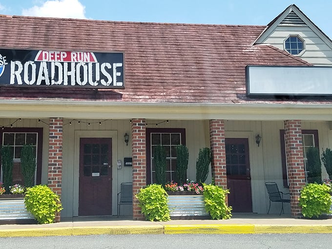 The unassuming exterior of Deep Run Roadhouse proves once again that the best BBQ joints often look like places your GPS would apologize for sending you to.