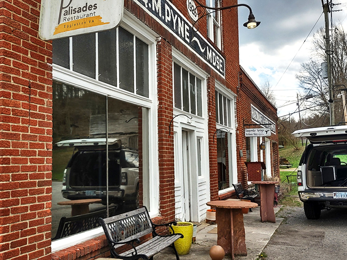 The historic O.M. Pyne building stands as a culinary time machine in tiny Eggleston. Red brick, weathered benches, and small-town charm set the stage for an extraordinary meal.