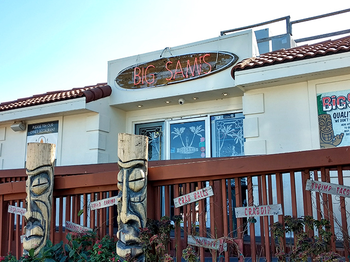 The neon glow of Big Sam's sign against the twilight sky &ndash; like a lighthouse guiding hungry sailors to seafood paradise.