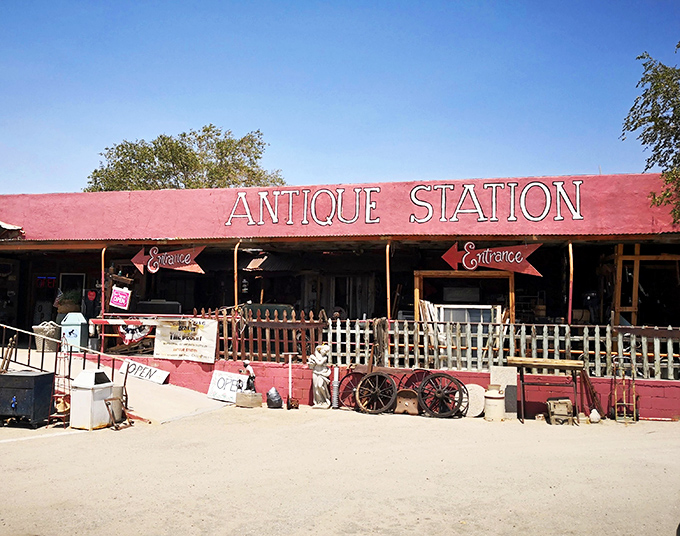 The desert sky creates a perfect backdrop for Antique Station's vibrant red fa&ccedil;ade. Route 66 charm doesn't get more authentic than this roadside treasure trove.