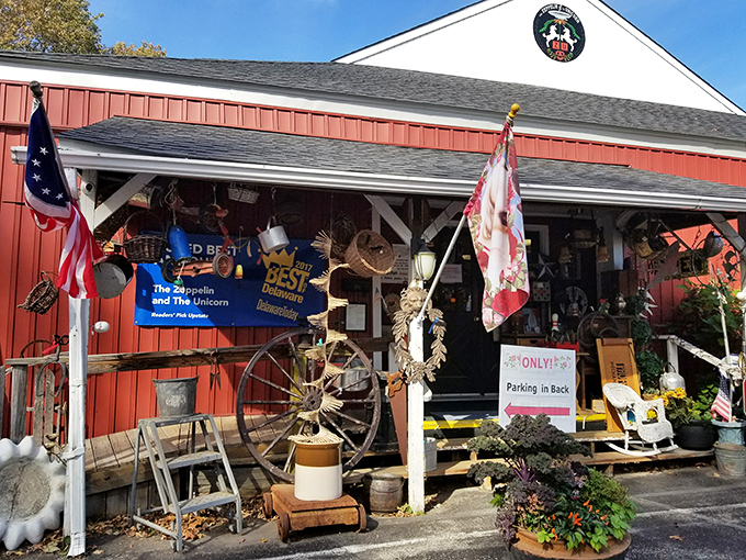 The red barn exterior of The Zeppelin and The Unicorn beckons like a portal to another time. Vibrant flowers and vintage flags hint at the treasures within.