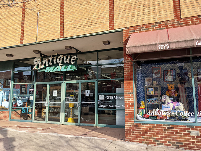 The vintage "Antique Mall" sign beckons like an old friend, promising treasures behind those glass doors on Massachusetts Street.