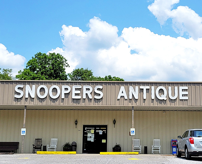 The unassuming exterior of Snoopers Antique belies the wonderland within. Like a treasure chest disguised as a toolshed, it patiently waits for curious explorers.