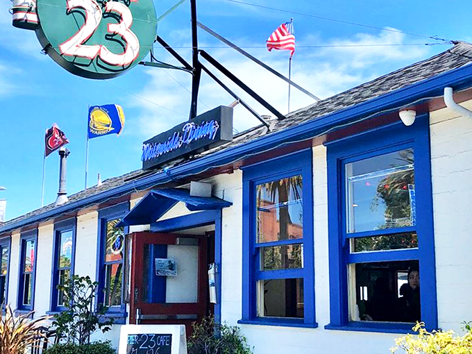 The iconic "23" sign beckons like a lighthouse for hungry souls navigating San Francisco's Embarcadero. Blue trim, waterfront charm, and promises of seafood paradise await.