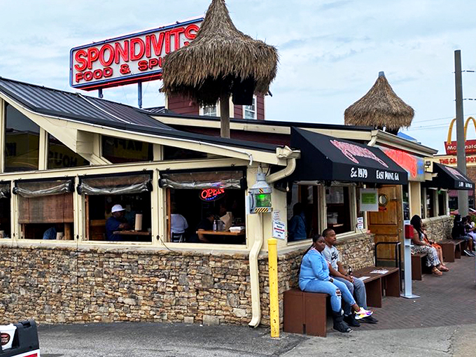The thatched-roof paradise of Spondivits beckons hungry travelers like a coastal mirage just minutes from Atlanta's busiest airport.
