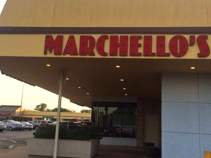 The bright red Marchello's sign stands out like a culinary lighthouse, beckoning hungry travelers to this unassuming strip mall treasure in Wichita.