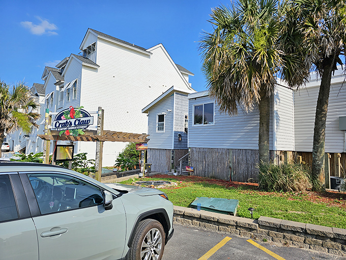 The entrance to paradise isn't pearly gates, but red stairs flanked by tiki totems and colorful flags announcing your arrival at seafood heaven.