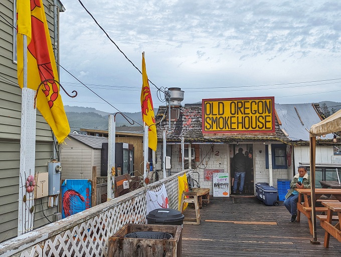 The yellow door beckons like a coastal lighthouse. This weathered shack with its bold sign promises seafood treasures that fancy restaurants can only dream about.