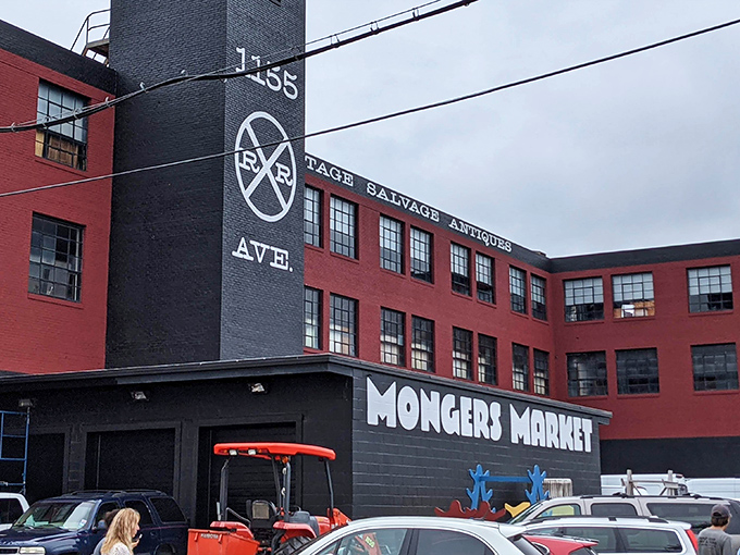 The iconic red brick and black smokestack of Mongers Market stands proudly on Railroad Avenue, a beacon for treasure hunters and nostalgia seekers.