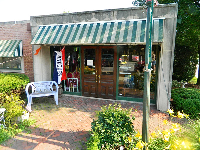 A treasure hunter's first glimpse of paradise. The brick storefront with its vibrant garden welcomes visitors like a time portal disguised as a neighborhood shop.