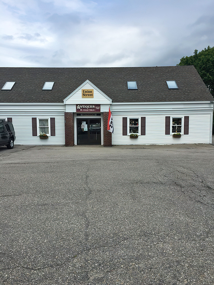 The unassuming exterior of Union Street Antiques beckons with its yellow sign and classic New England charm&mdash;a time portal disguised as a simple white building.