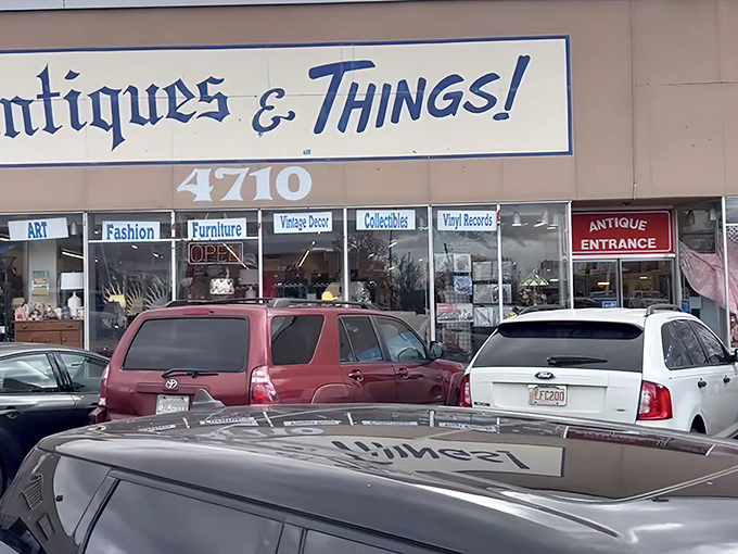 The storefront beckons with promises of treasures within, its blue lettering against beige like a desert sky invitation to explore.