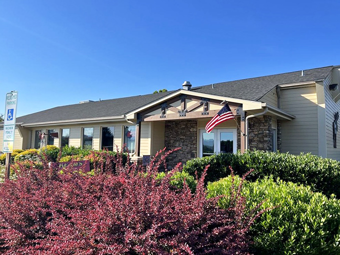 The welcoming fa&ccedil;ade of Moose Cafe in Asheville, where the landscaping is as thoughtfully prepared as the comfort food waiting inside. 