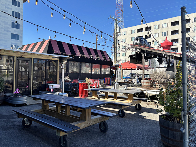 The iconic white brick exterior of LUNCH.SUPPER! with its jaunty red and black awning promises Southern comfort before you even step inside.