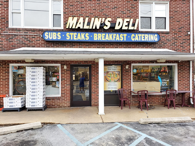 The unassuming brick facade of Malin's Deli stands like a sandwich sentinel in Newark, promising delicious treasures within for those wise enough to stop.