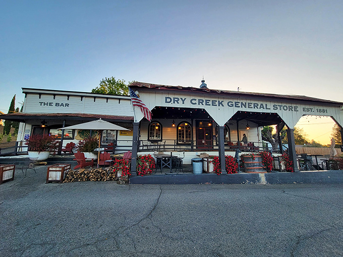The white clapboard facade of Dry Creek General Store stands proudly against the California sky, a time capsule from 1881 that's still very much alive and kicking.