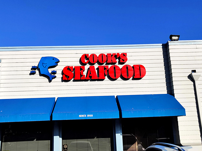 The unassuming blue-awninged exterior of Cook's Seafood stands as a beacon to seafood lovers, proving that culinary treasures often hide in plain sight.