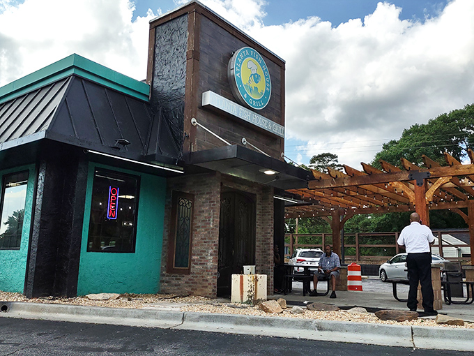 The teal-accented exterior with its wooden pergola isn't just inviting&mdash;it's a promise of seafood greatness waiting inside.