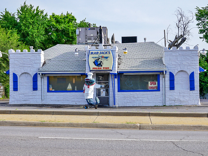 The castle-like exterior of Mad Jack's Fresh Fish stands as a blue-trimmed beacon of seafood hope in landlocked Kansas City.