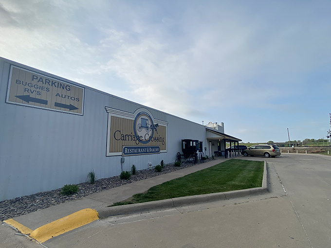 The unassuming white exterior of Carriage Crossing stands like a beacon of hope for hungry travelers. Kansas sunshine optional, cinnamon rolls guaranteed.