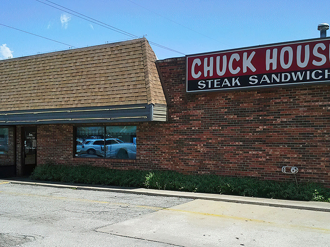 The unassuming brick exterior of Chuck House might not scream "culinary destination," but that yellow-trimmed roof has sheltered decades of delicious memories.