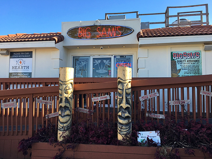 The neon glow of Big Sam's sign against the twilight sky &ndash; like a lighthouse guiding hungry sailors to seafood paradise.