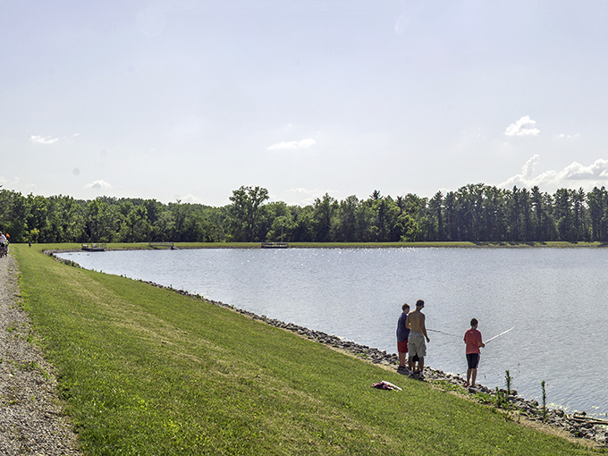 A bird's-eye view of paradise! Ouabache State Park unfolds like nature's own patchwork quilt, with lush forests, winding roads, and a shimmering lake.