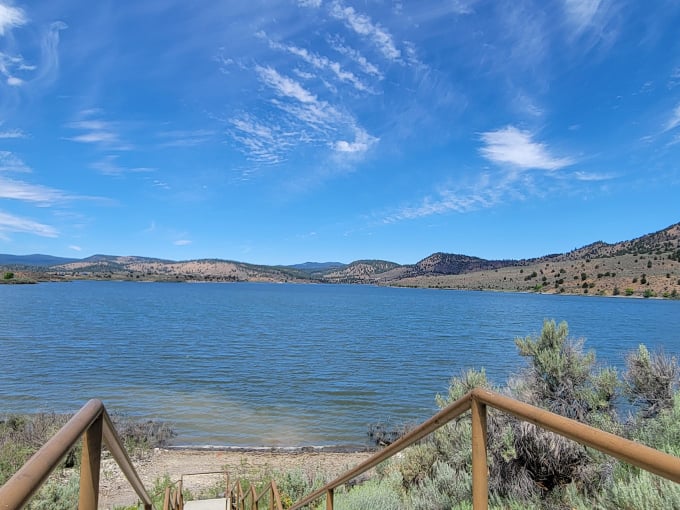 Mirror, mirror on the lake! Unity Lake's glassy surface reflects the sky like nature's own Instagram filter.