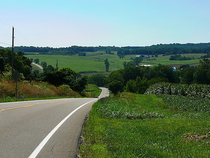 The open road stretches before you like nature's welcome mat, with clouds performing their own version of Cirque du Soleil overhead.