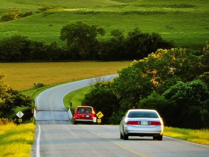 The road stretches toward infinity like nature's treadmill, minus the gym membership and with significantly better views.
