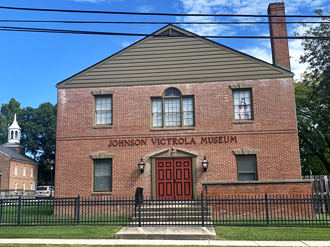 The brick façade and bold red door of the Johnson Victrola Museum stand as Delaware's unassuming temple to recorded sound history.