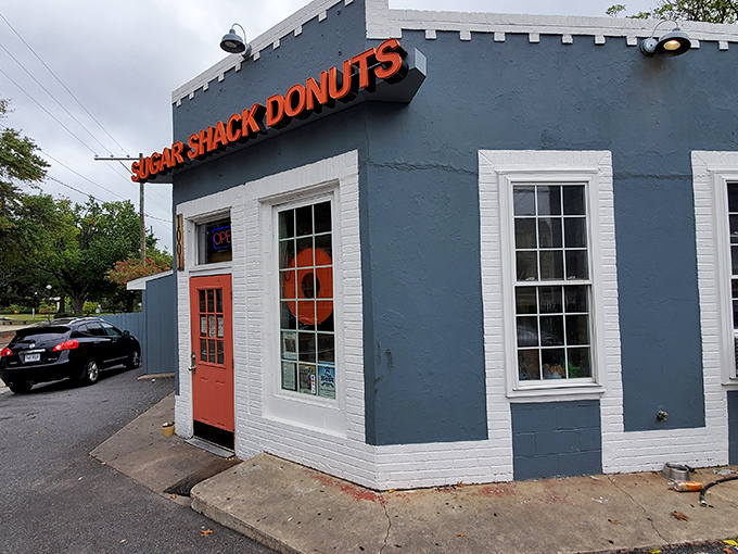 That iconic orange door isn't just an entrance&mdash;it's a portal to donut nirvana. The unassuming gray exterior hides Richmond's sweetest secret.