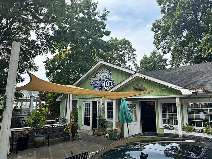 The lime-green cottage with its blue door and whimsical lizard sign is like stumbling into a Dr. Seuss book where delicious food awaits.