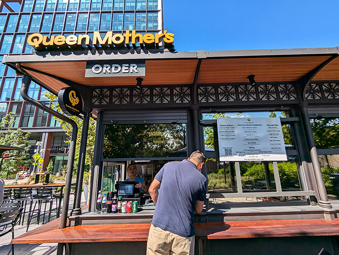The sleek black exterior of Queen Mother's Kitchen stands like a modern-day chicken temple in Arlington. Simplicity with swagger.