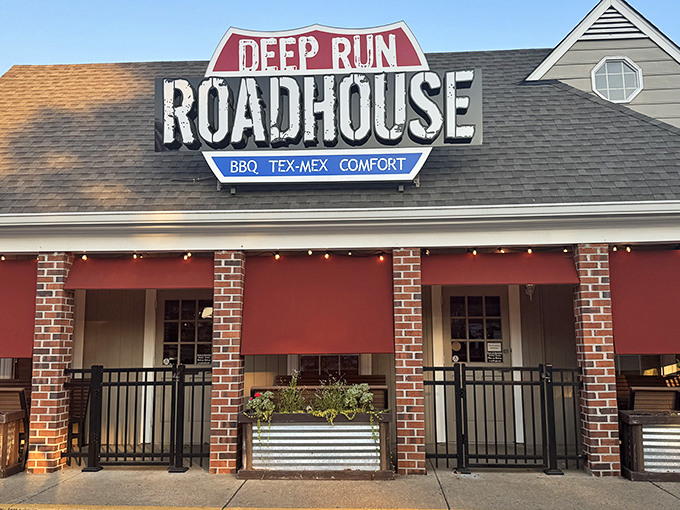 The unassuming exterior of Deep Run Roadhouse proves once again that the best BBQ joints often look like places your GPS would apologize for sending you to.