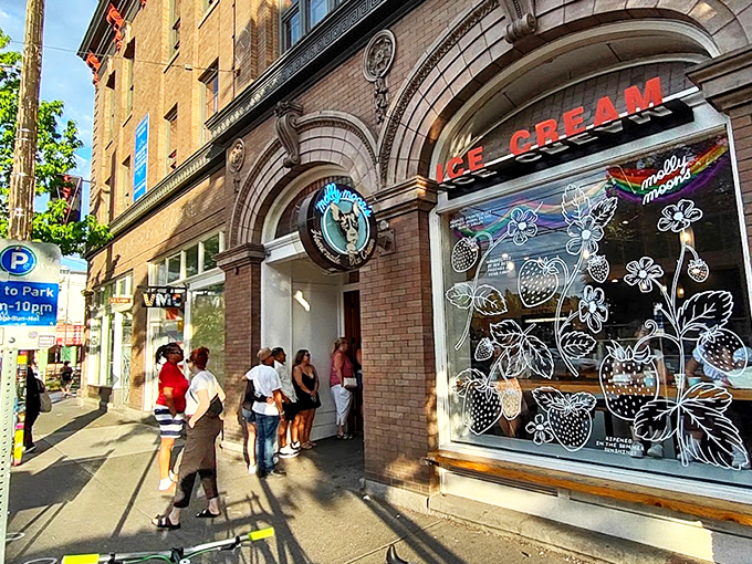 The architectural equivalent of "come hither" &ndash; Molly Moon's storefront beckons with its classic brick fa&ccedil;ade and neon glow, promising sweet relief from Seattle's bustling streets. 