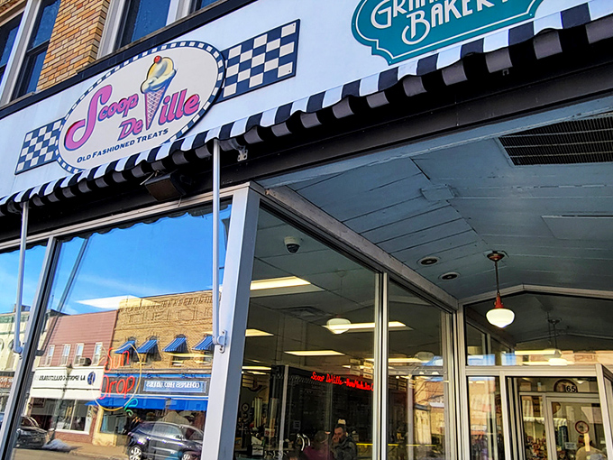 The classic checkered facade of Scoop De Ville stands like a time portal to simpler days when ice cream was the ultimate problem solver. 