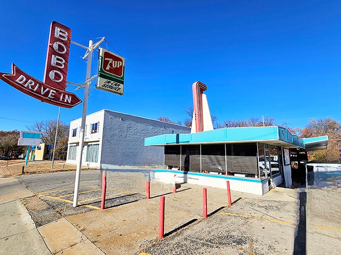 A slice of Americana stands proudly against the Kansas sky, its turquoise trim and cherry-red accents promising delicious nostalgia by the plateful.