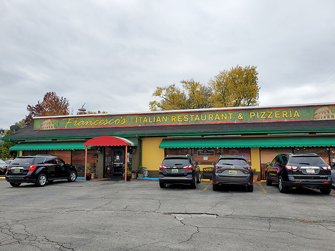 The cheerful yellow exterior with its red and green awnings isn't just inviting&mdash;it's practically shouting "authentic Italian food inside!" like a culinary town crier.