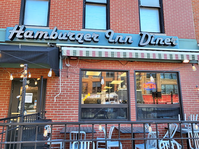 The classic brick fa&ccedil;ade and vintage sign of Hamburger Inn Diner stand as a time capsule on Delaware's main street, beckoning hungry travelers since 1932.