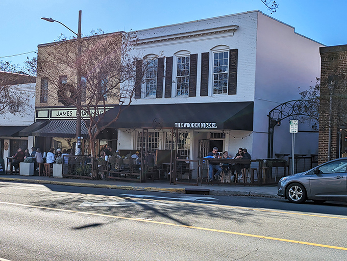 The Wooden Nickel's classic white facade stands proudly on Hillsborough's King Street, beckoning hungry travelers with the promise of comfort and conversation.
