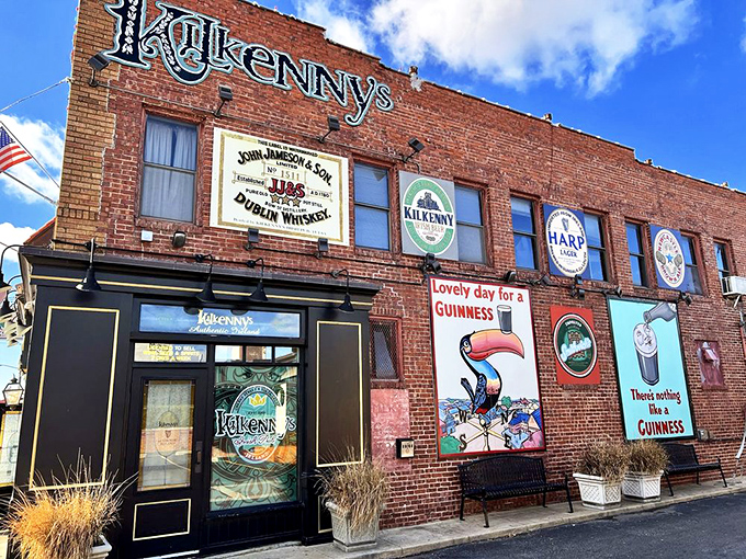 The brick facade of Kilkenny's stands proudly on Cherry Street, its vintage Guinness murals and emerald signage promising authentic Irish comfort in the heart of Tulsa.