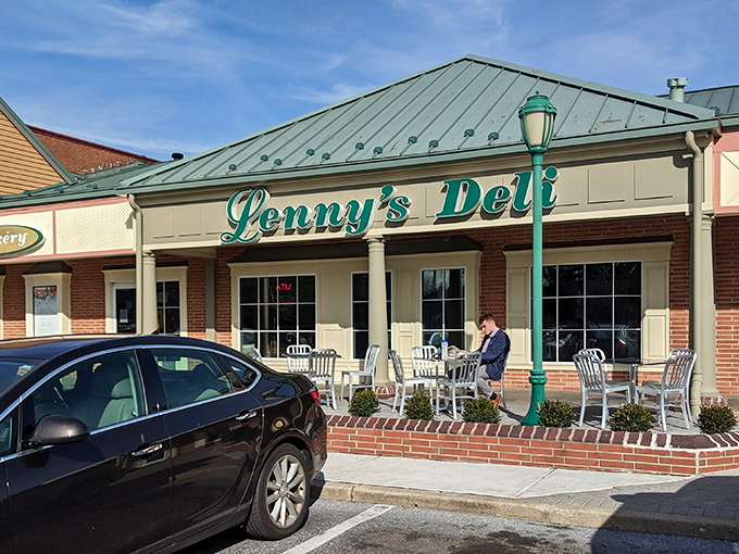 The teal script of Lenny's Deli against brick and cream siding isn't just signage&mdash;it's a promise of comfort food that transcends trends and satisfies souls.