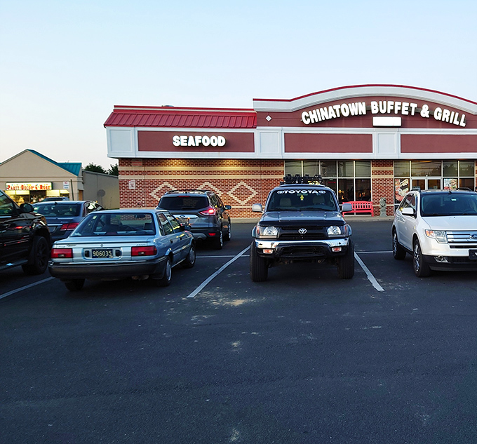 The iconic red-roofed exterior of Chinatown Buffet & Grill stands like a beacon of culinary promise in Rehoboth Beach, boldly announcing "SEAFOOD" to hungry passersby. 