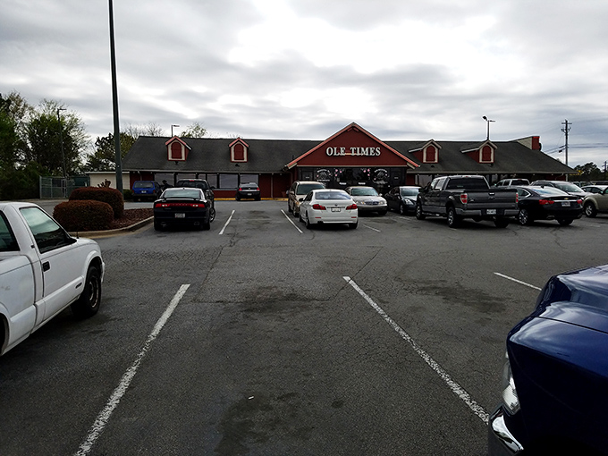 The iconic red barn exterior of Ole Times Country Buffet stands like a beacon of Southern comfort food, promising delicious abundance within those welcoming walls.