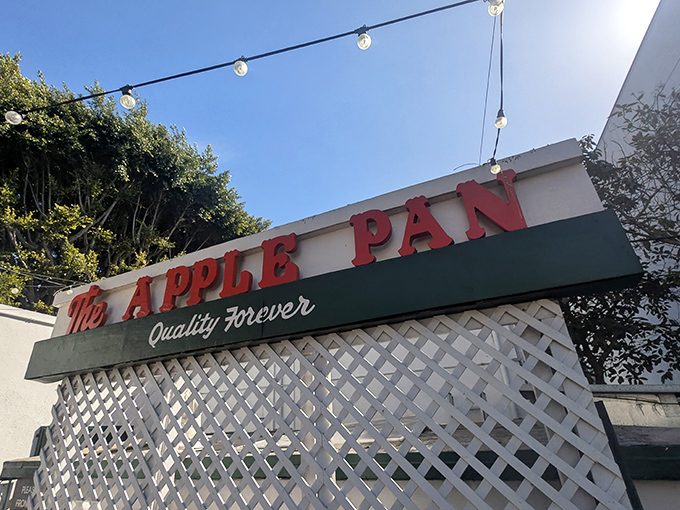 The unassuming exterior of The Apple Pan stands like a time capsule amid modern LA, its vintage sign promising "Quality Forever" &ndash; a bold claim they've somehow managed to keep.