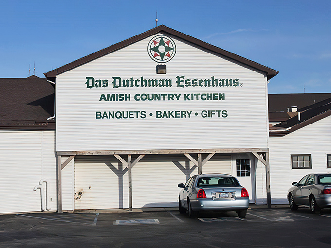 The classic white facade of Das Dutchman Essenhaus announces itself like a culinary lighthouse beckoning hungry travelers to the shores of comfort food paradise.